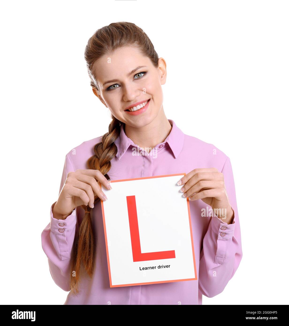 Young woman with learner driver sign on white background Stock Photo ...