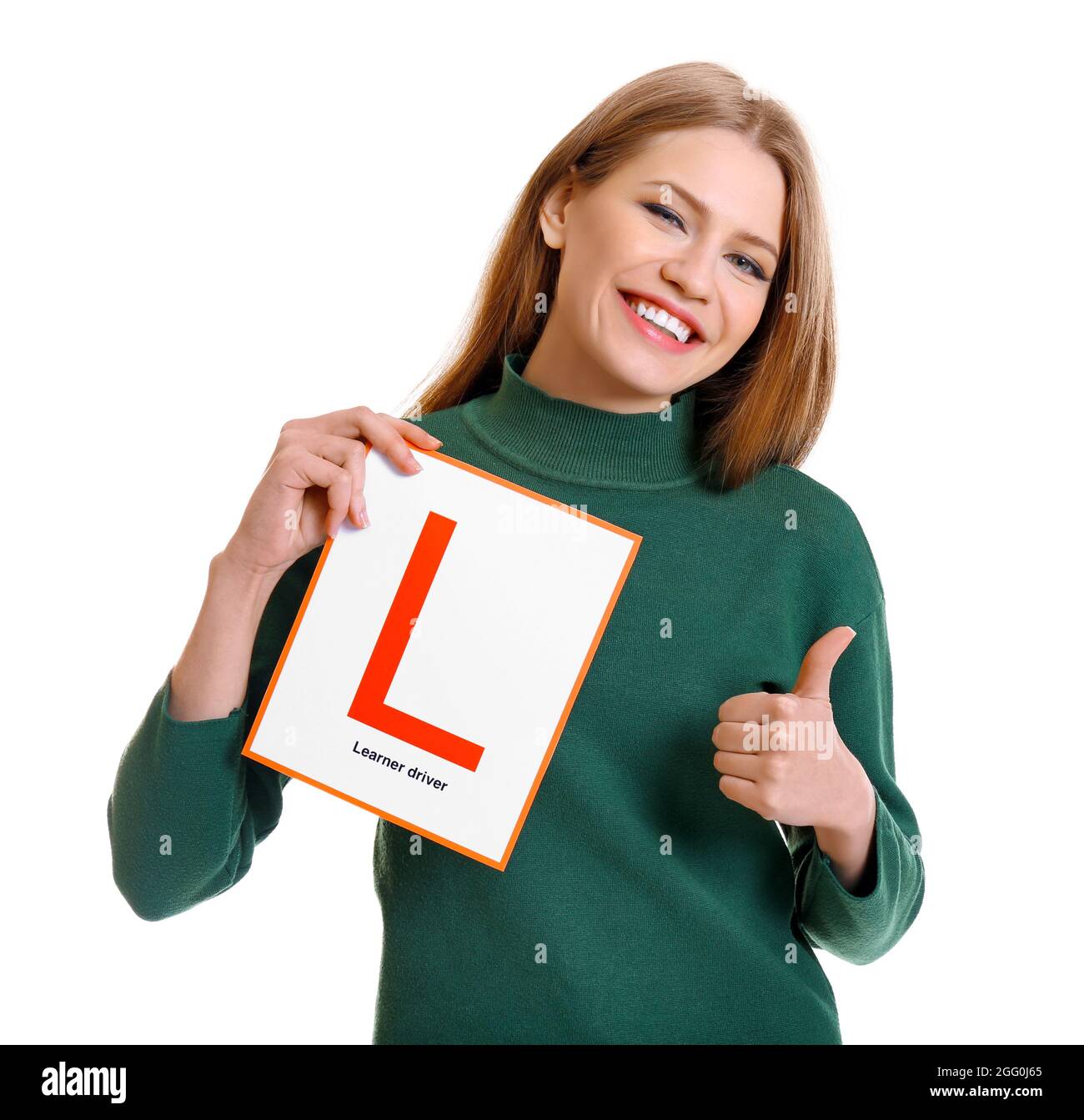Young woman with learner driver sign on white background Stock Photo ...