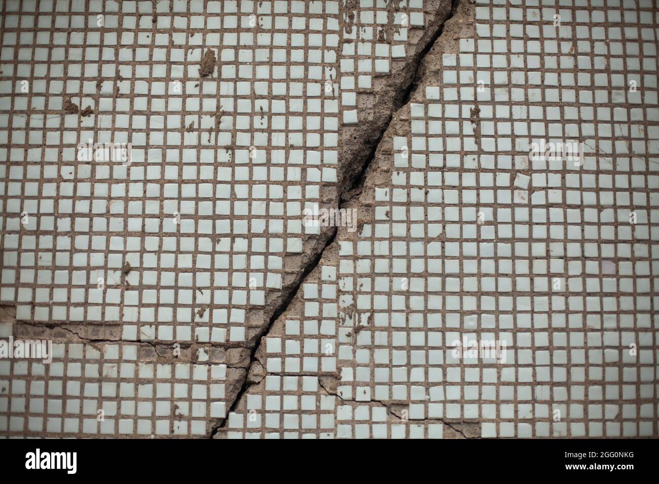 The texture of the collapsed tiles. The tiles on the wall cracked and ...