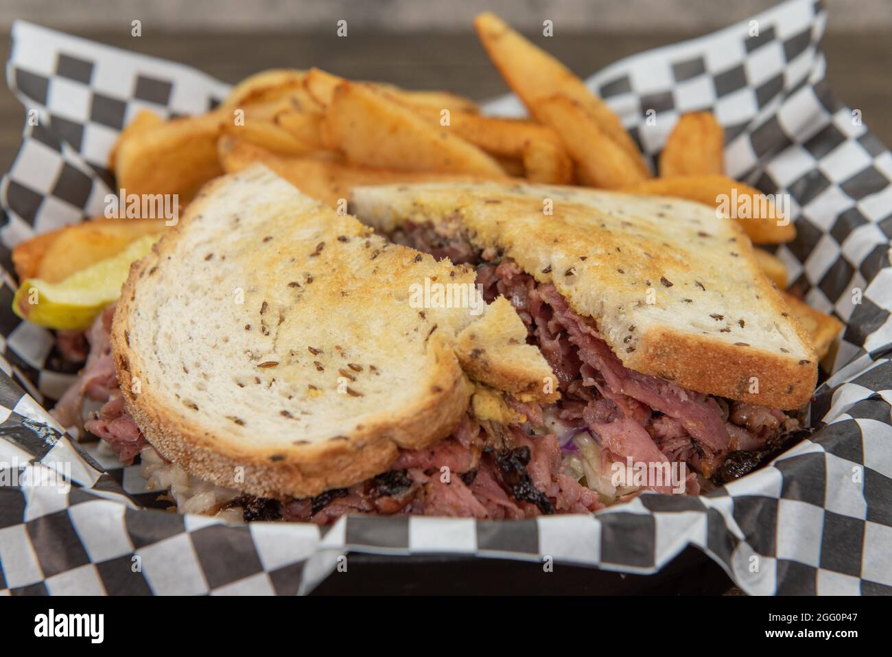 Pastrami sandwich with corned beef on grilled rye bread served with ...