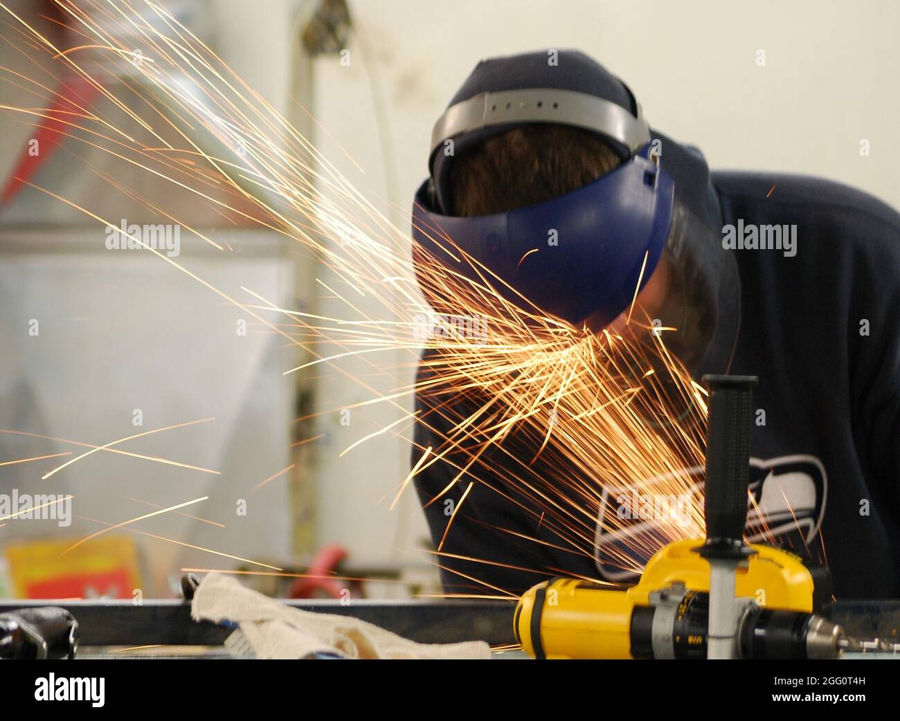 Metal grinding man Stock Photo - Alamy