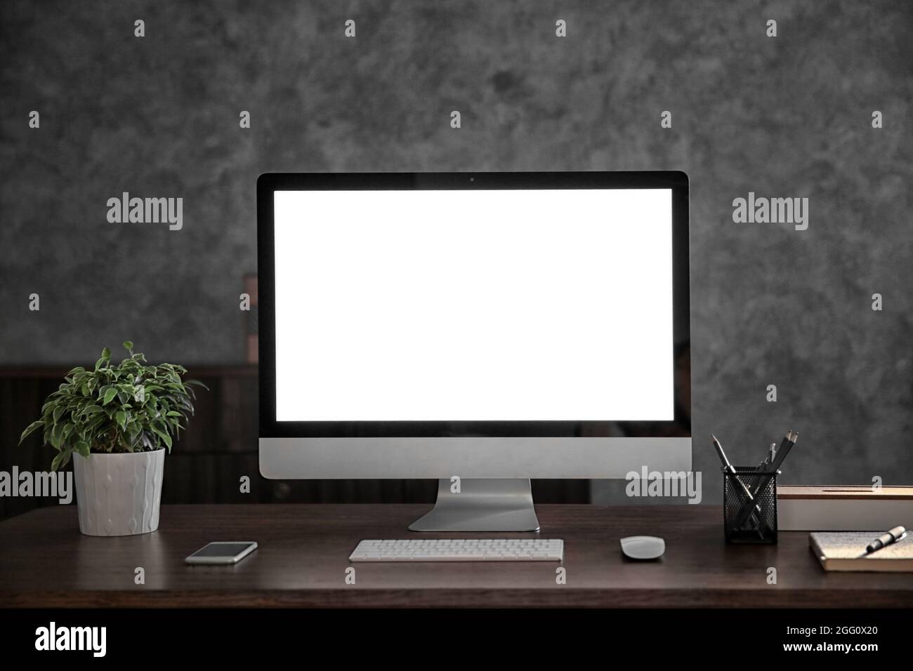Modern computer monitor on wooden desk Stock Photo - Alamy