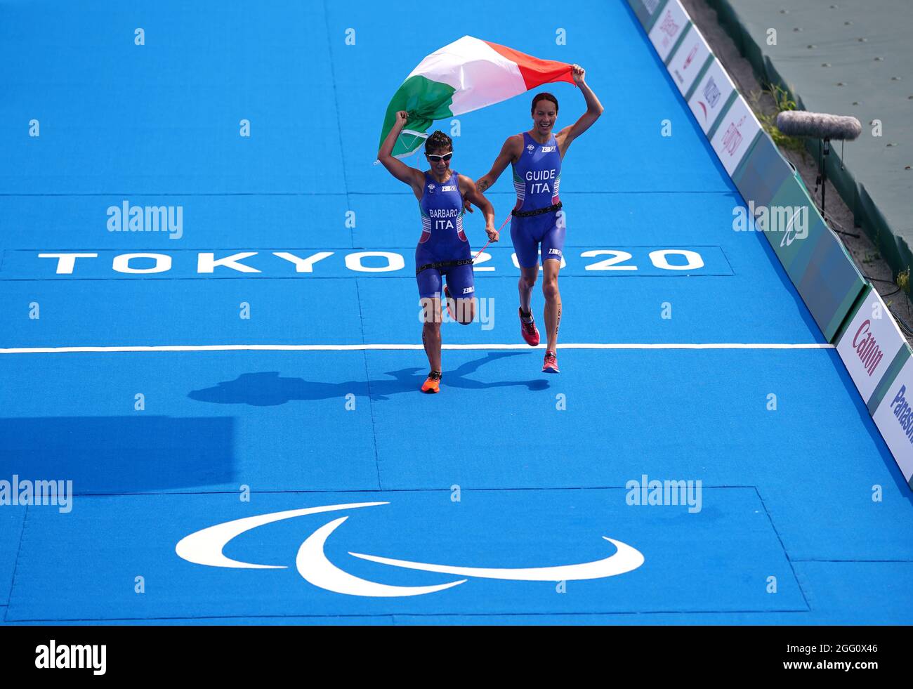 Italy's Anna Barbaro and guide Charlotte Bonin cross the line to win ...