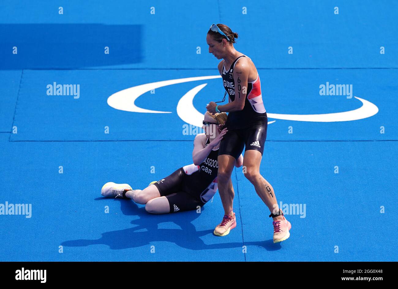 Great Britain's Alison Peasgood collapses next to guide Nikki Bartlett ...