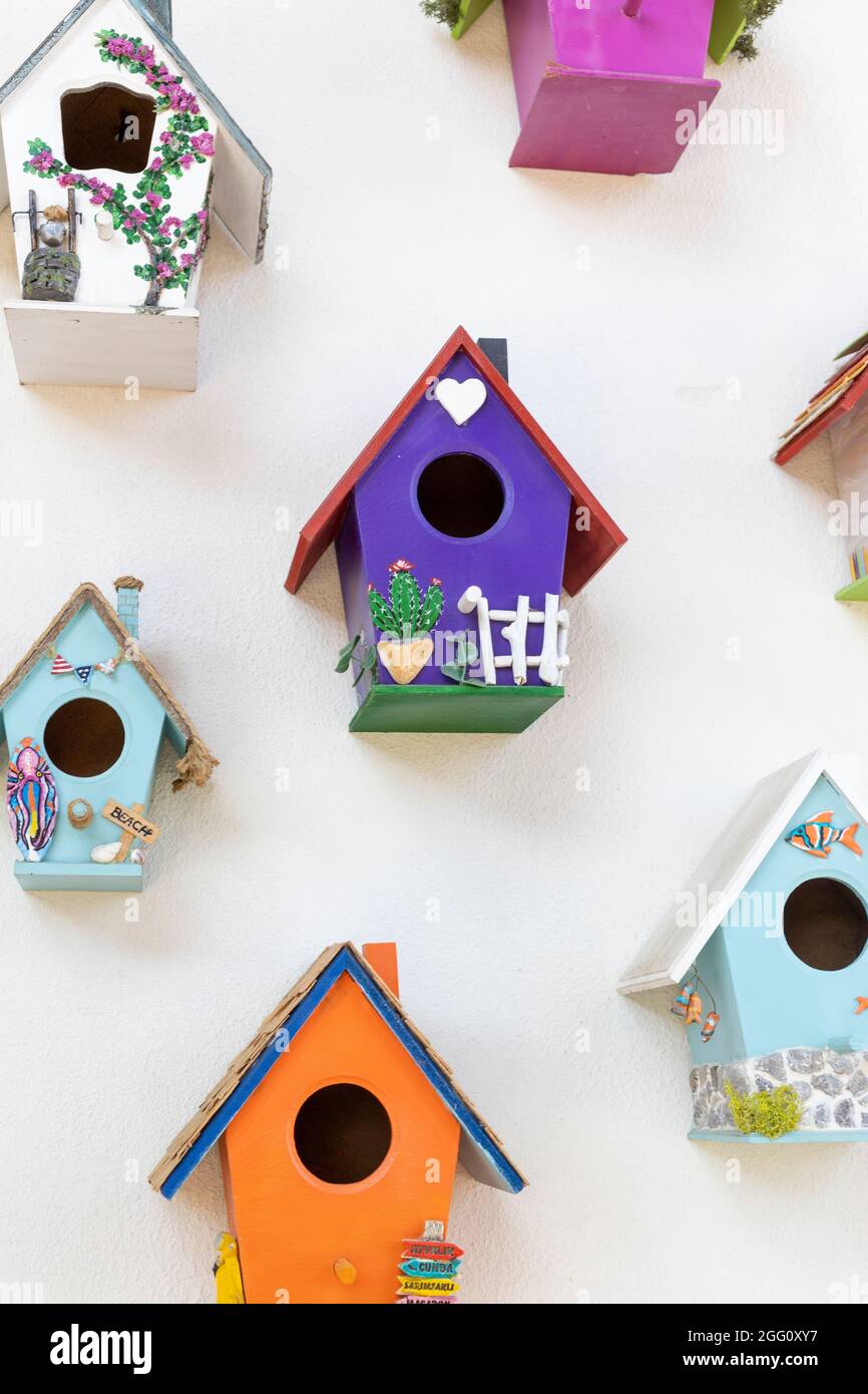 Colorful birdhouses close-up. Hanging on the wall. Much Stock Photo - Alamy