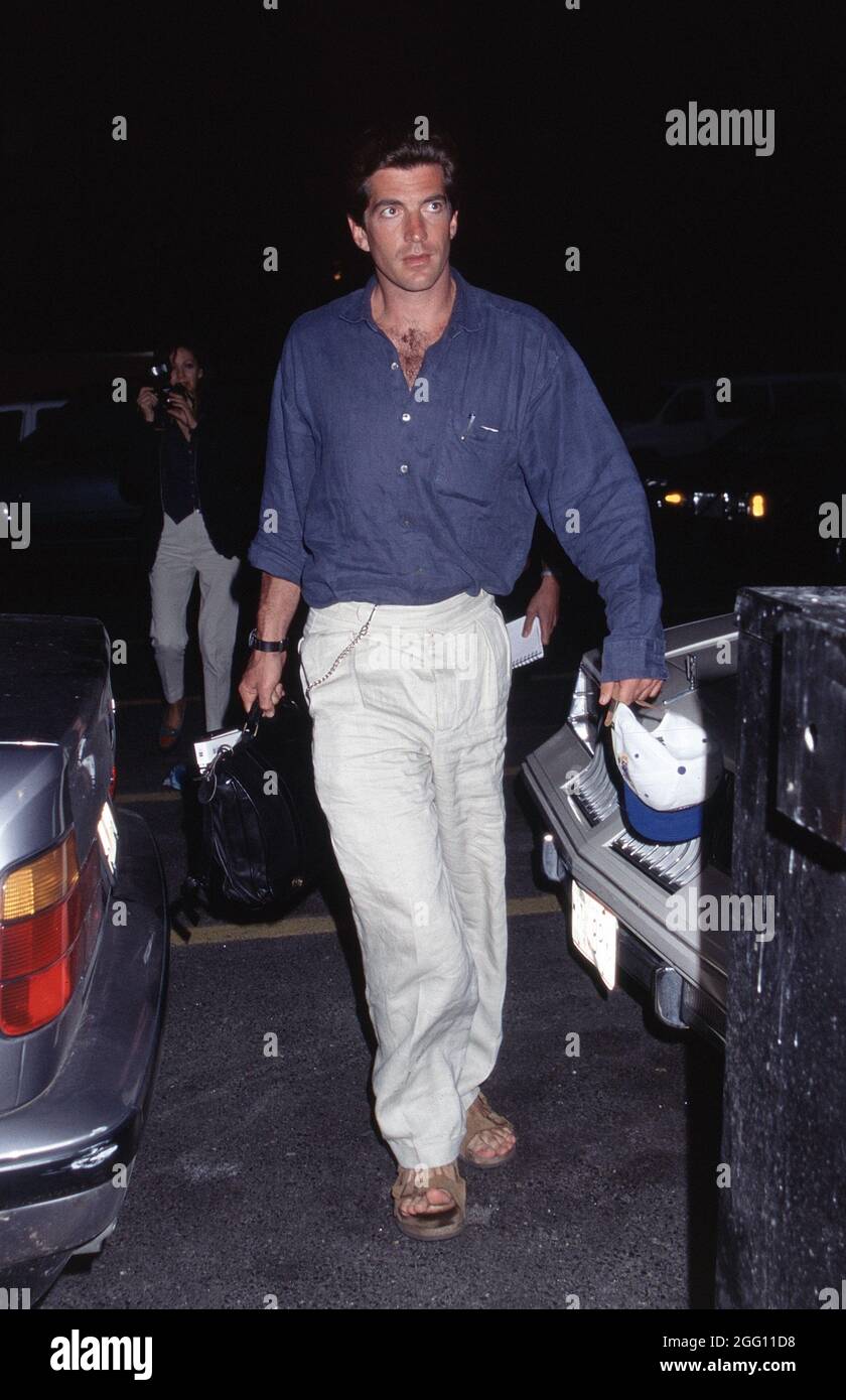 John Kennedy Jr. leaving George Magazine office and picking up his ...