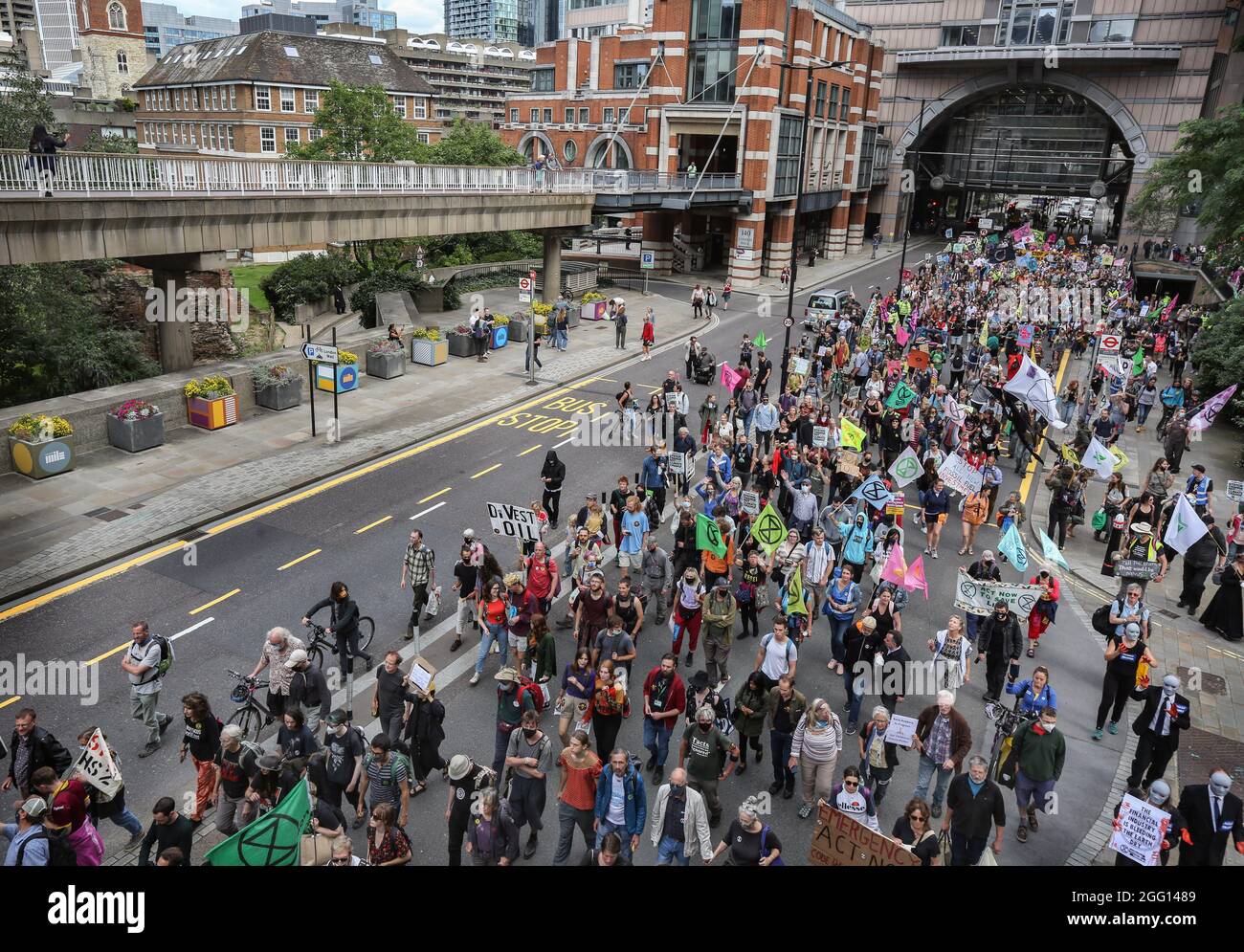 Rebels with flags drums and signs march around the City of London as ...