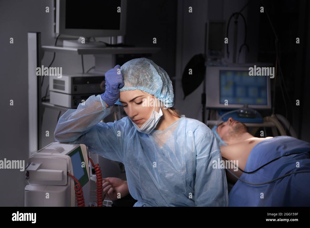 Sad doctor after failed operation in clinic Stock Photo - Alamy