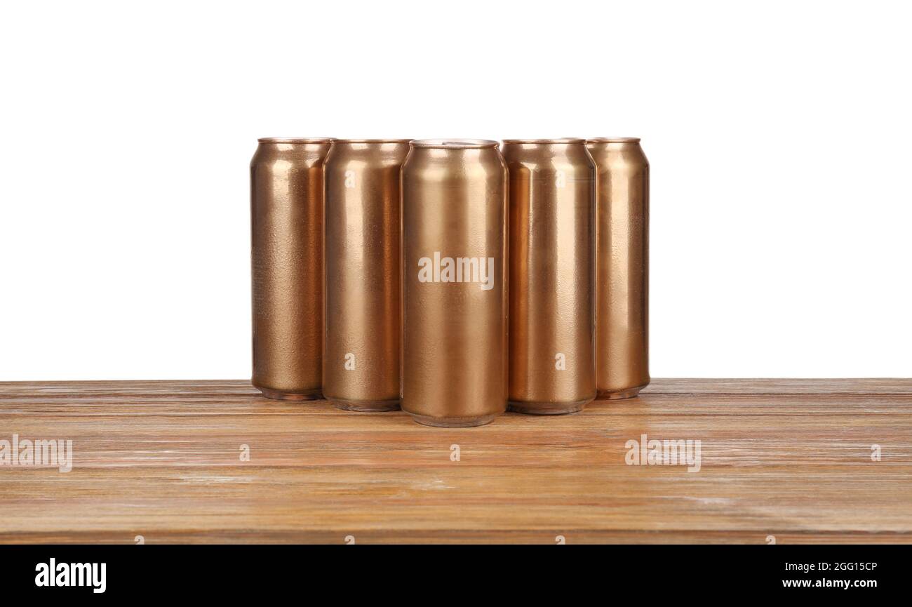 Cans of beer on table against white background Stock Photo - Alamy