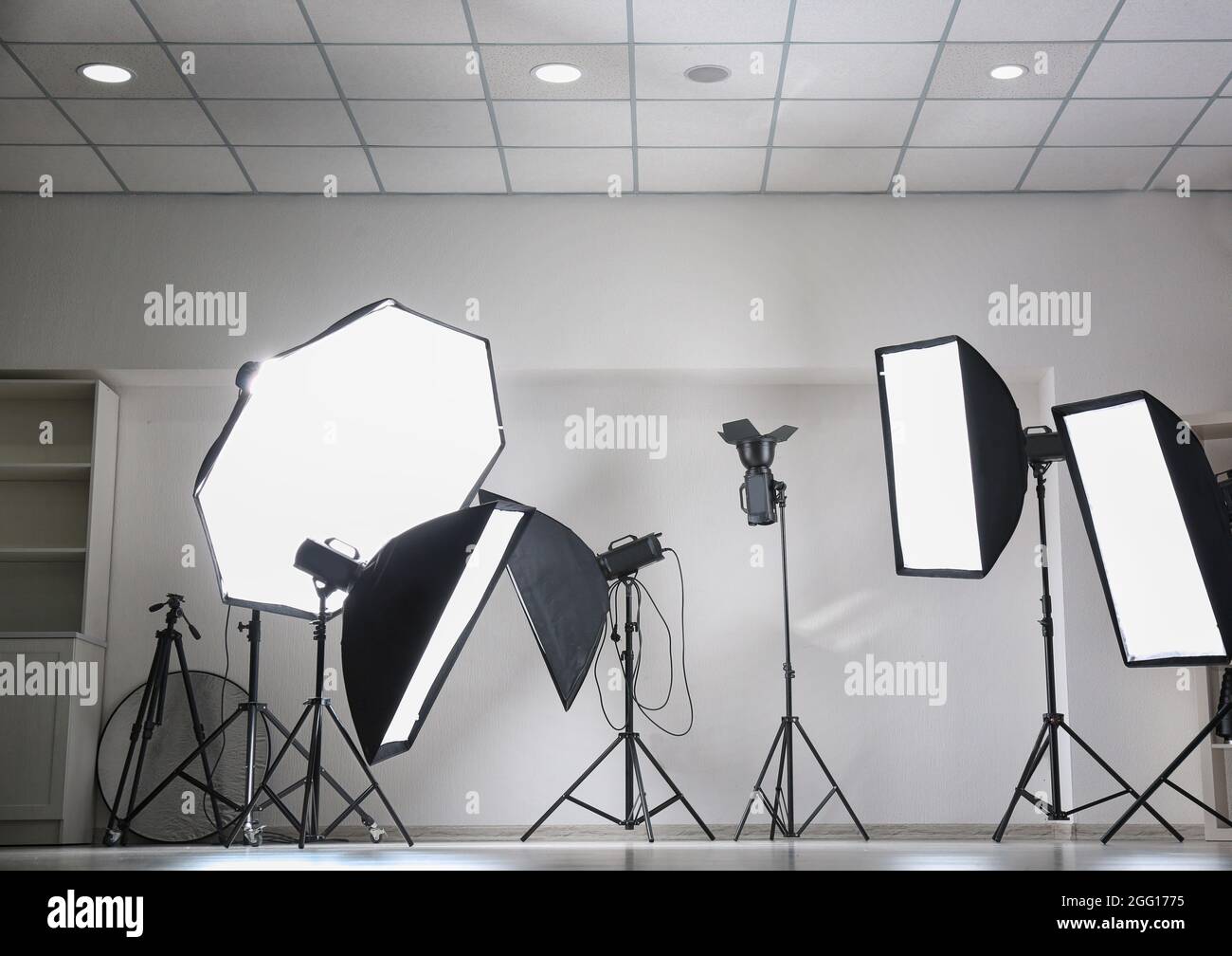 Empty photo studio with lighting equipment Stock Photo - Alamy