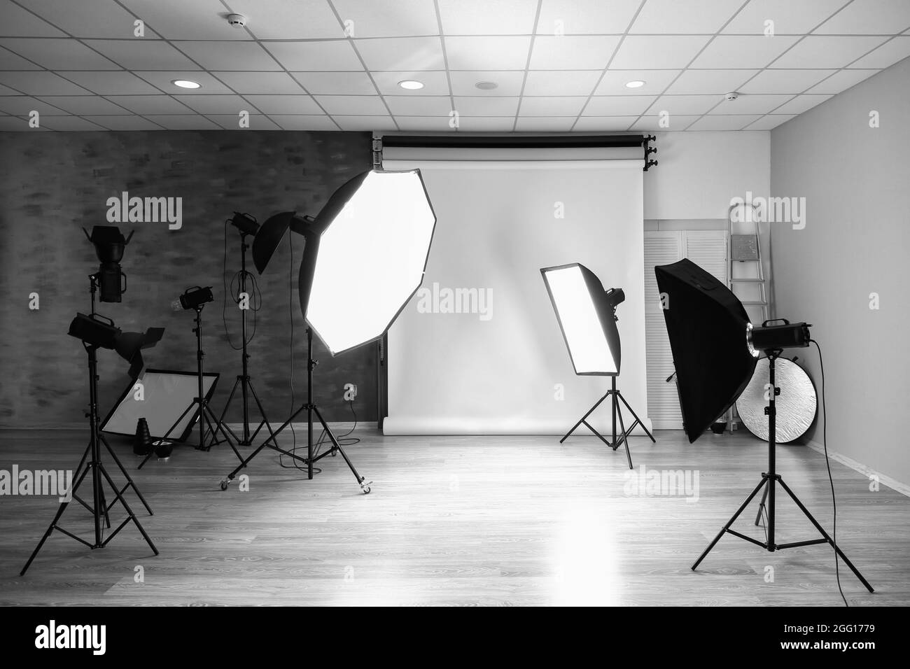 Empty photo studio with lighting equipment Stock Photo - Alamy