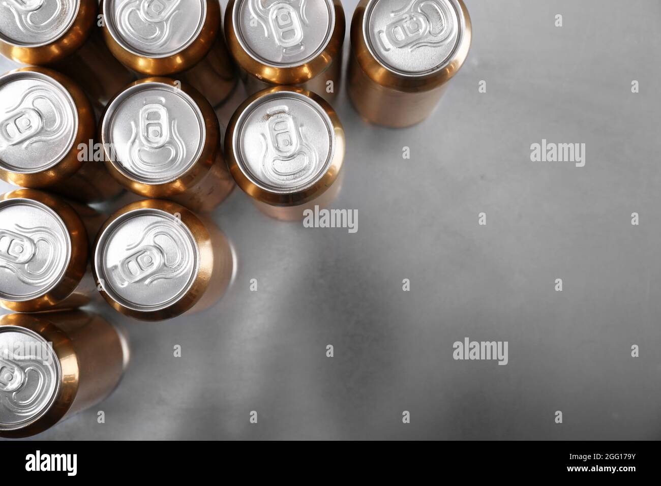 Cans of beer on gray table, top view Stock Photo - Alamy