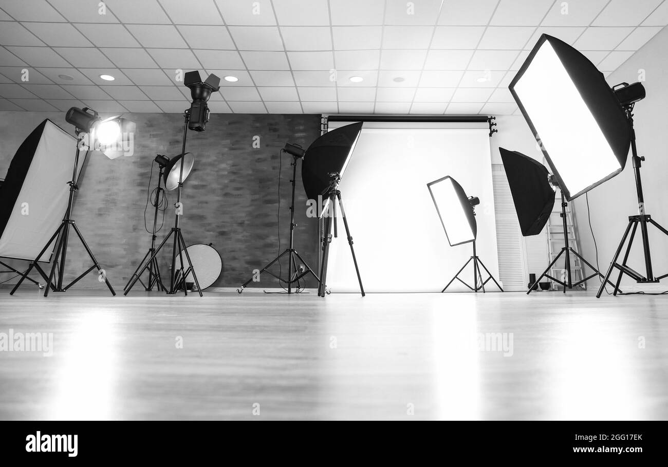 Empty photo studio with lighting equipment Stock Photo - Alamy