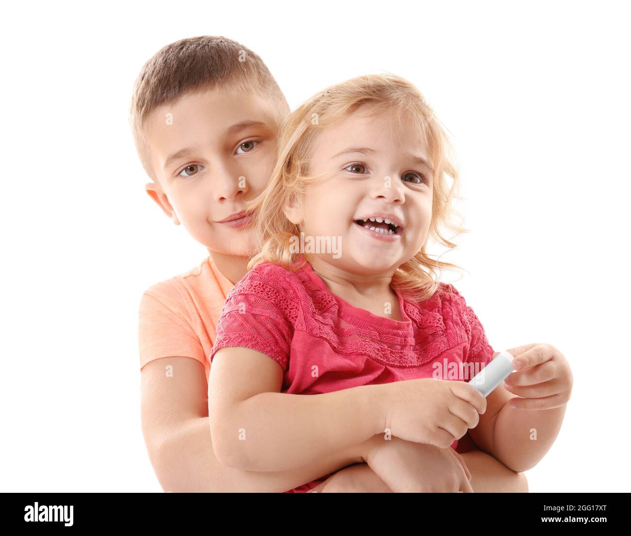 Cute little brother and sister on white background Stock Photo - Alamy