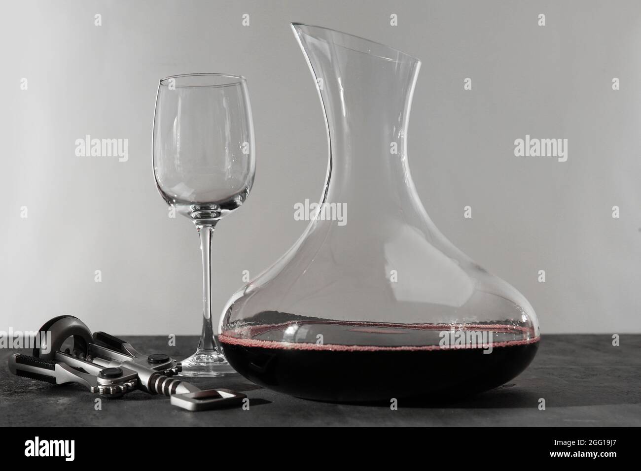 Glass carafe of red wine on gray table Stock Photo - Alamy