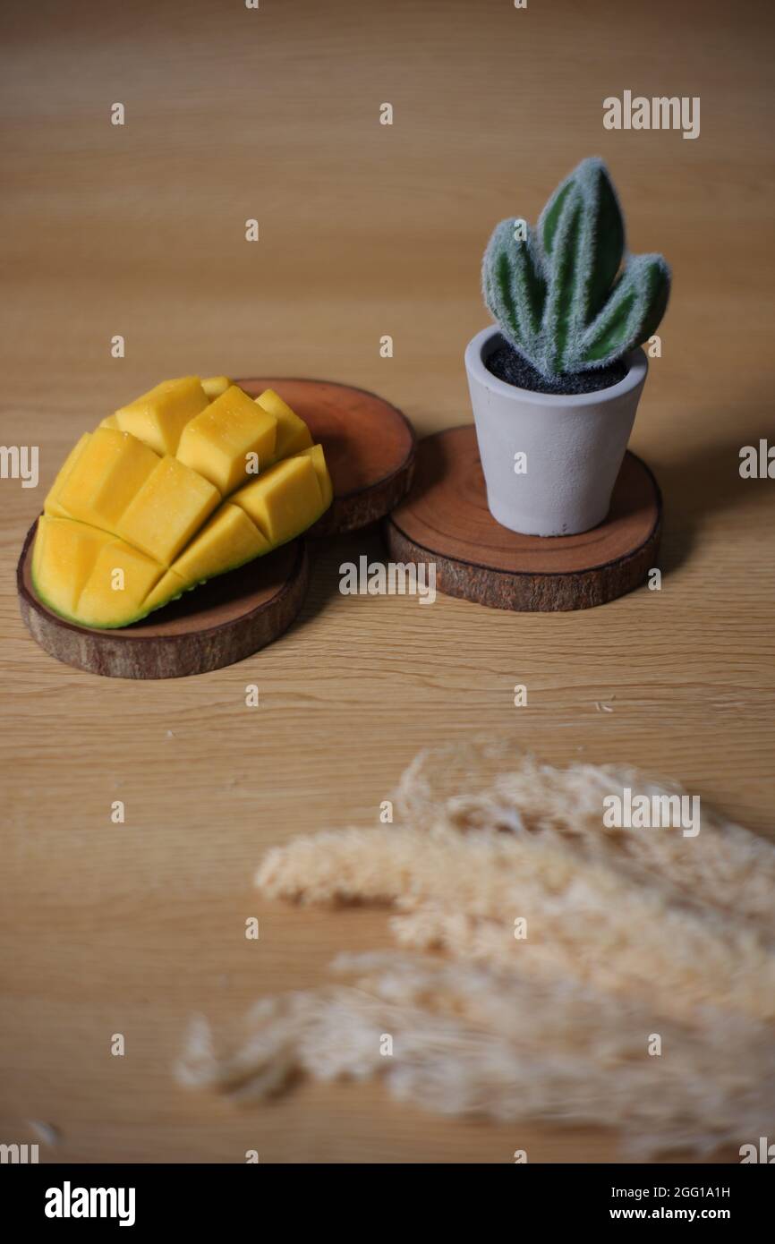 pieces of mango shaped like a blooming flower. fresh fruit and cute ...