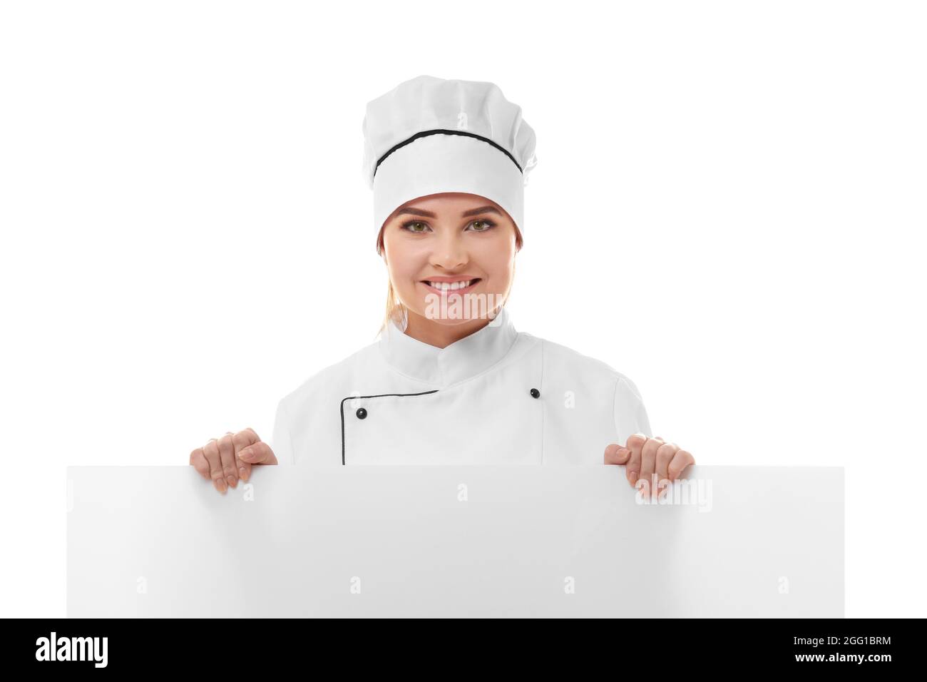 Young woman chef holding white blank banner isolated on white ...