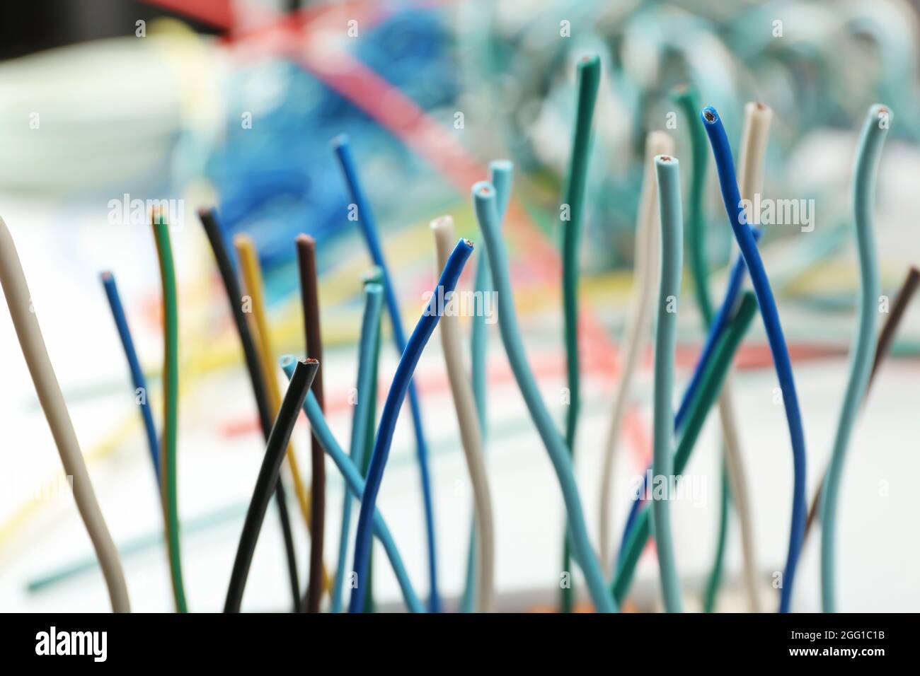 Different wires on blurred background, closeup Stock Photo - Alamy