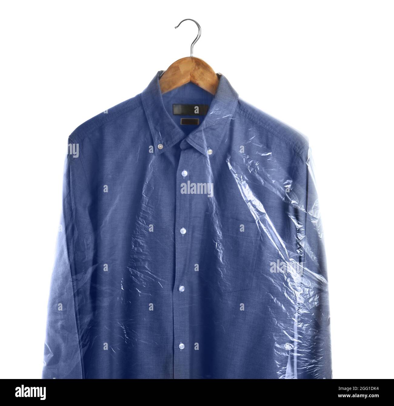 Clean clothes from dry-cleaning on white background Stock Photo - Alamy