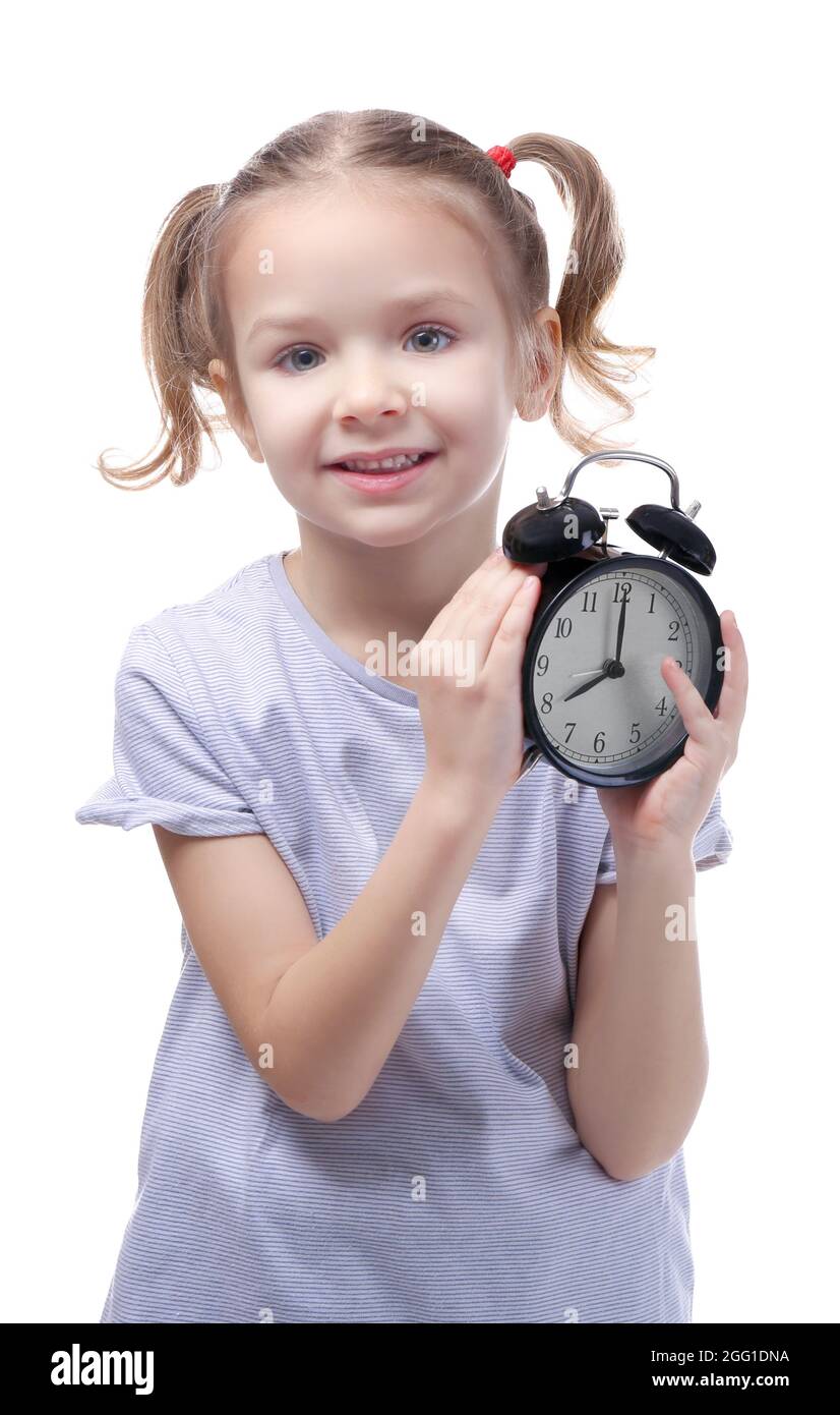 Cute little girl with alarm clock on white background Stock Photo - Alamy