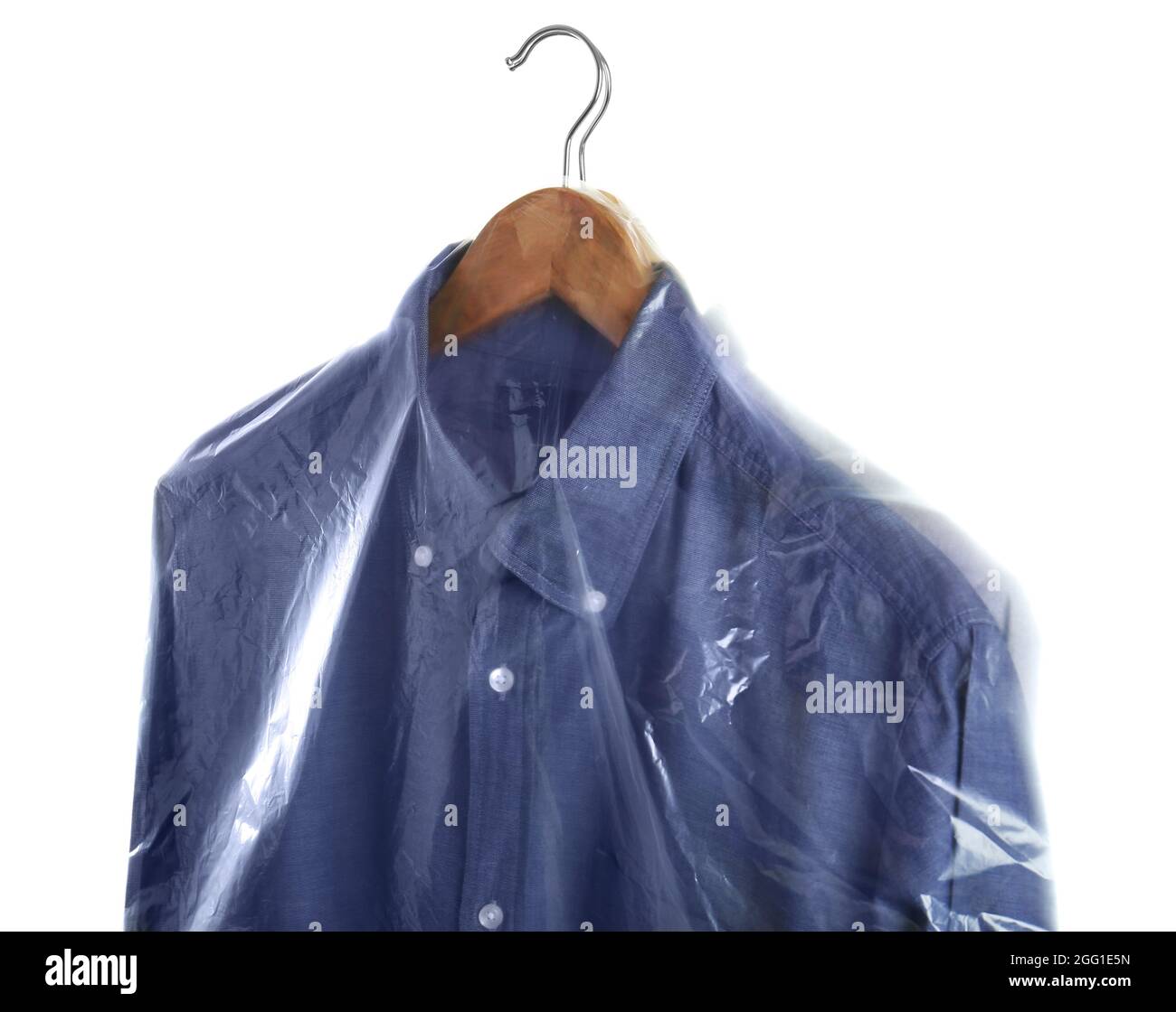 Clean clothes from dry-cleaning on white background Stock Photo - Alamy