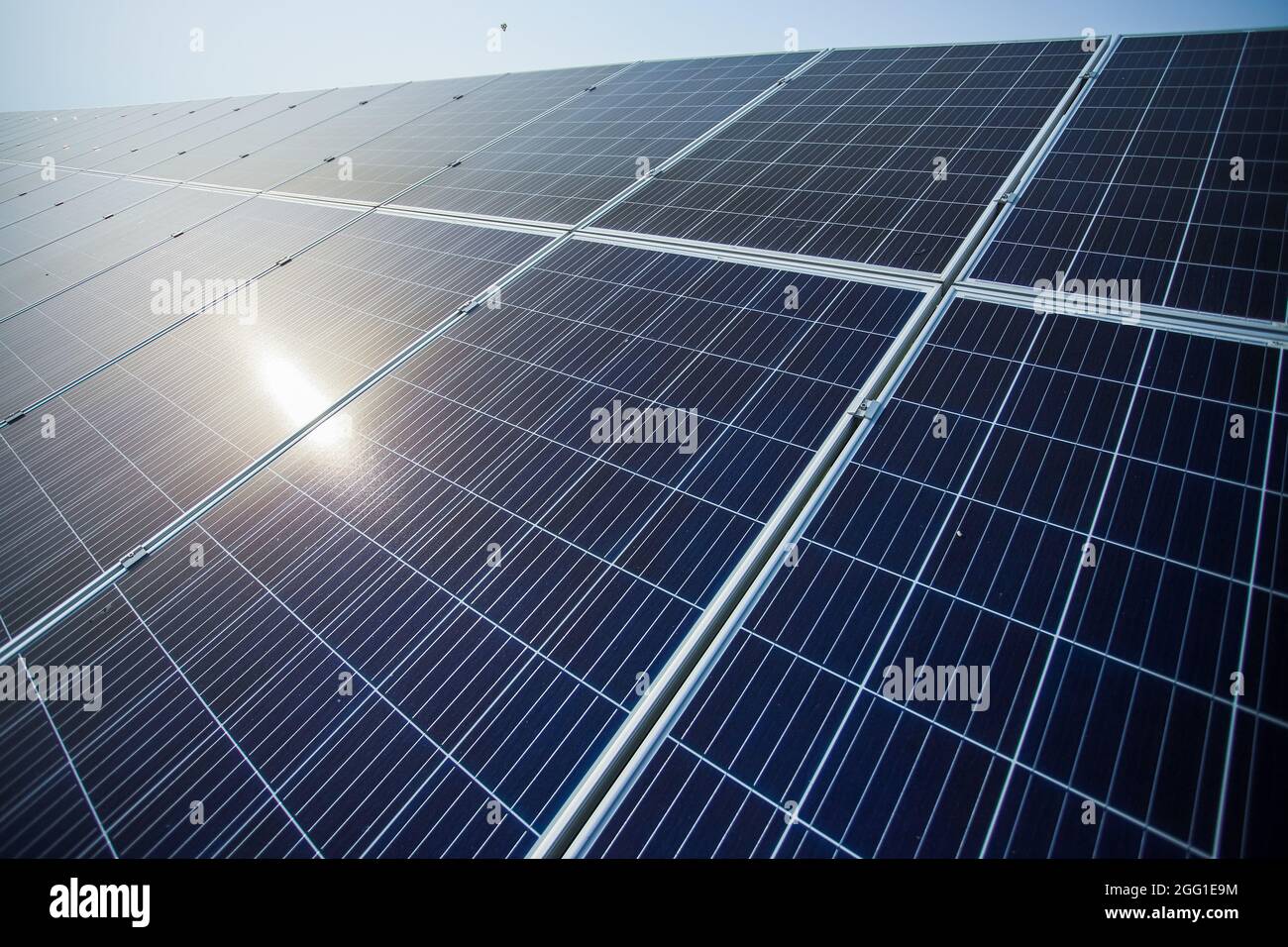 A sun's rays fall beautifully on solar panels Stock Photo - Alamy