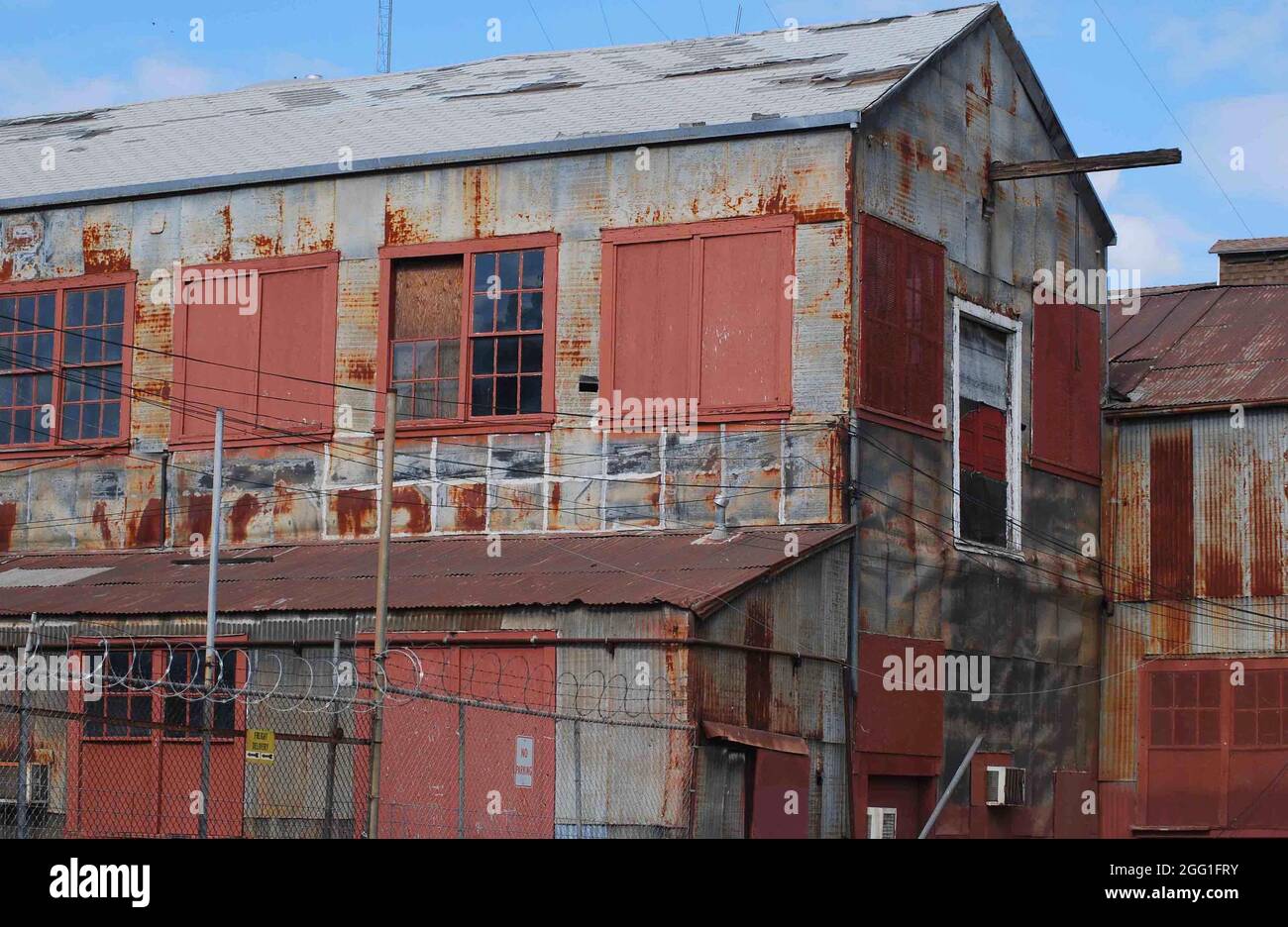 A dilapidated factory decays in a small town in California, as rust ...