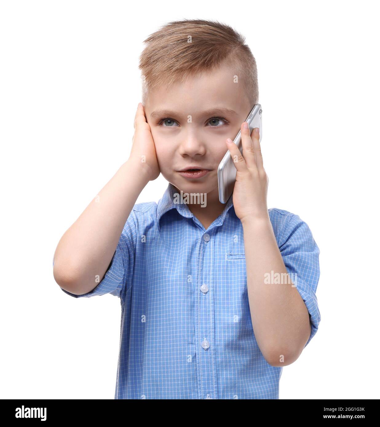 Cute little boy talking by mobile phone on white background Stock Photo ...