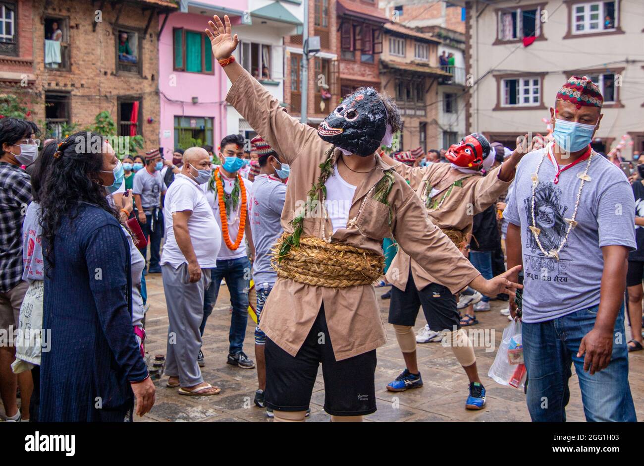 Nepalese youth plays traditional instruments during parade of Gai Jatra ...