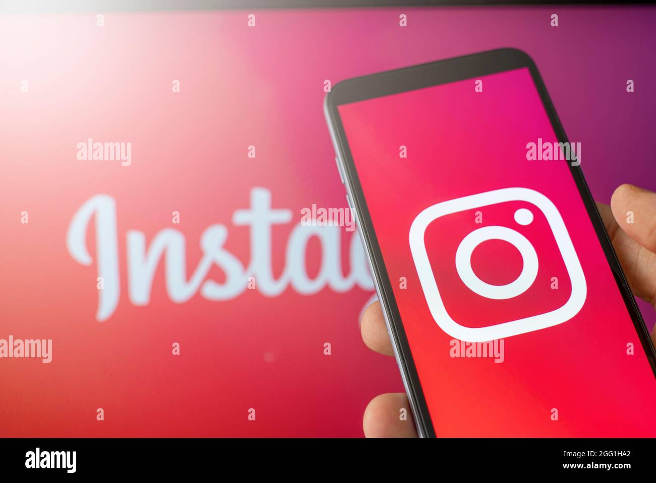 Phone showing Instagram app on the screen. Instagram is a photo and ...