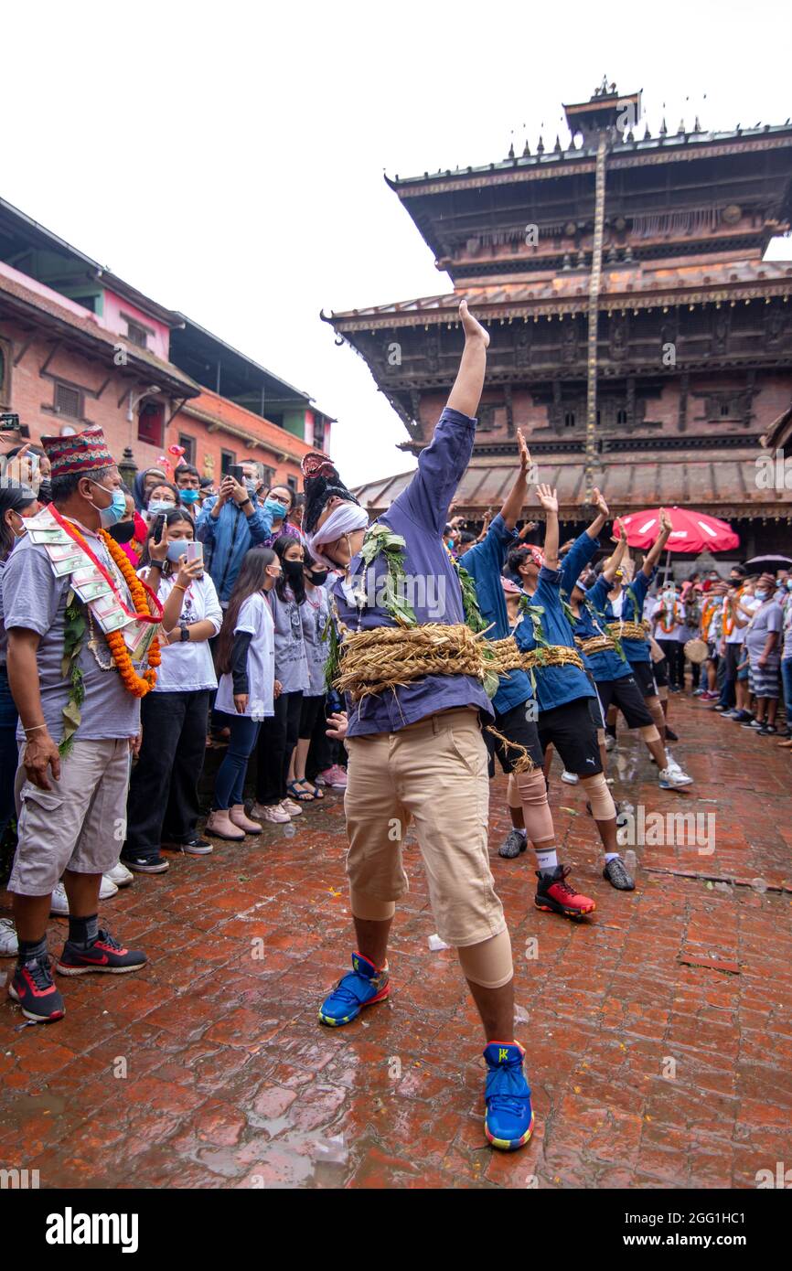 Nepalese youth plays traditional instruments during parade of Gai Jatra ...