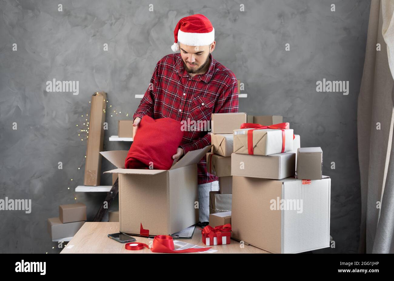 Caucasian male business owner is happy after a new order from a ...