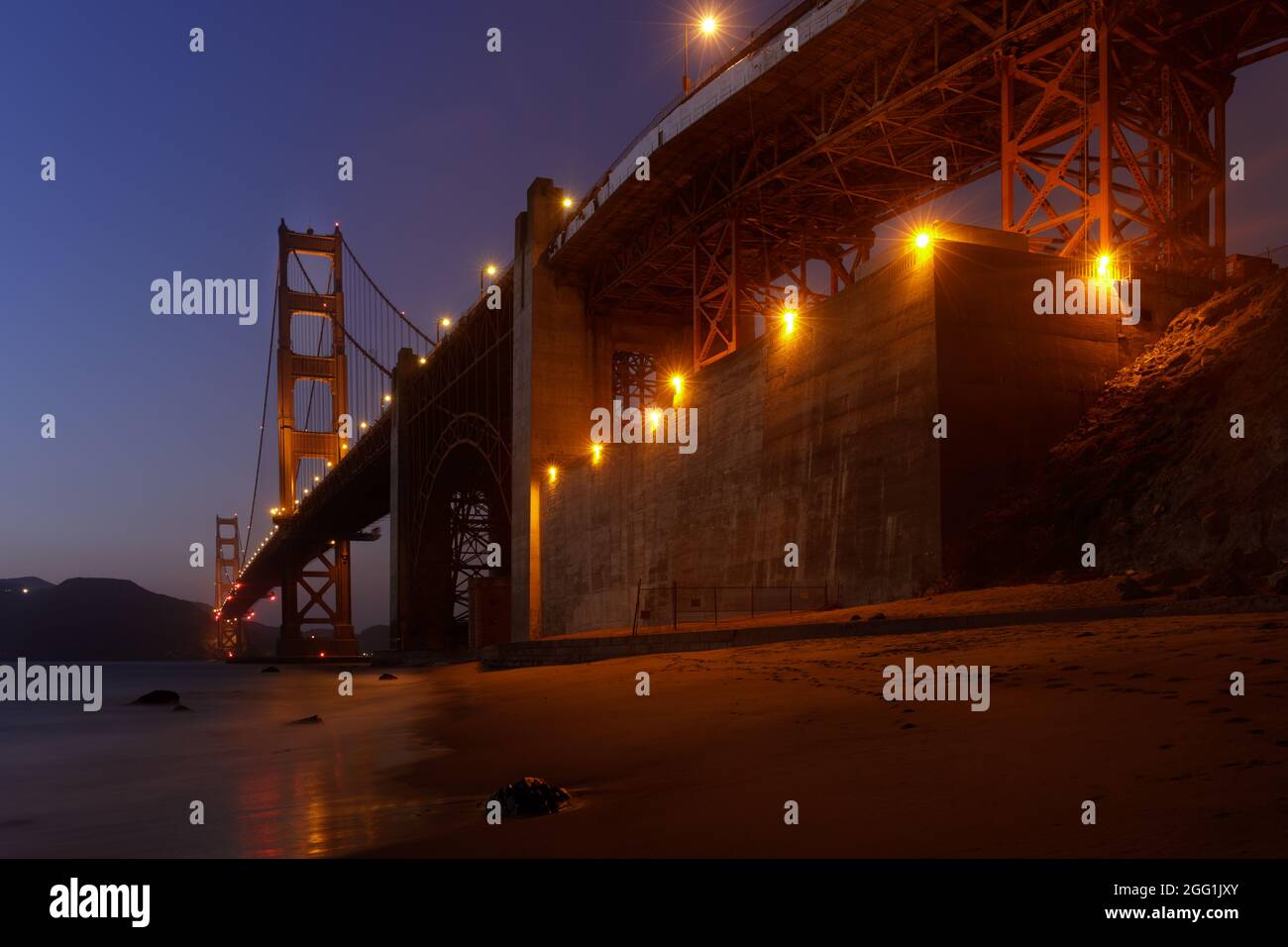 Below the Golden Gate Bridge at low tide in the blue hour. Marshall's ...