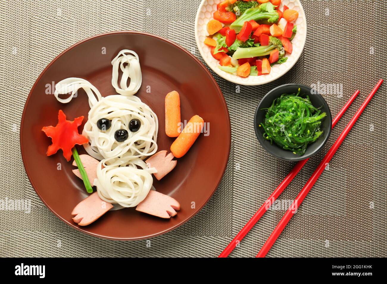 Plate with creative pasta for children on mat Stock Photo - Alamy
