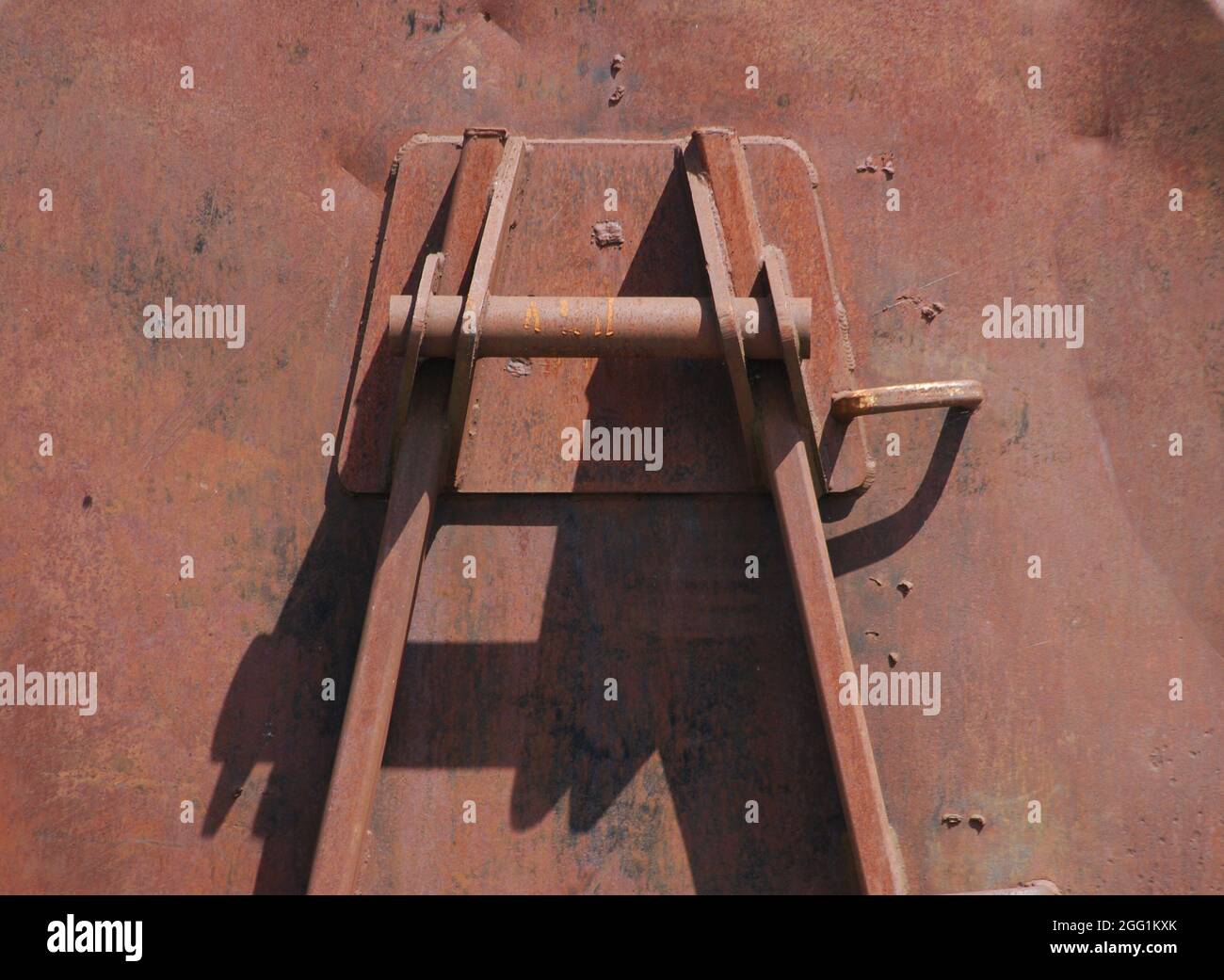 Tanker car fitting on a the end of a train car Stock Photo - Alamy