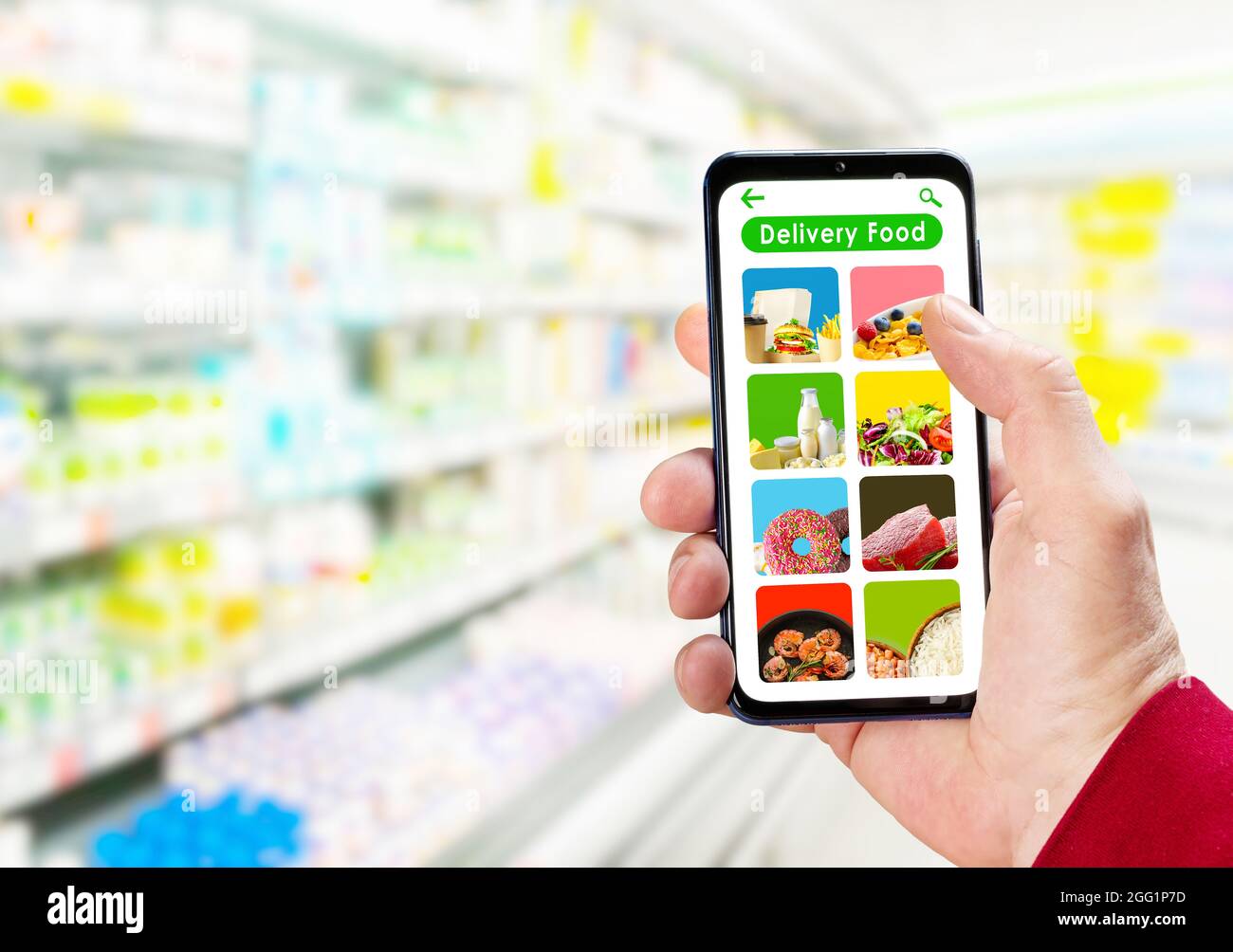 Male hand holding phone with app delivery food on screen on blurred ...