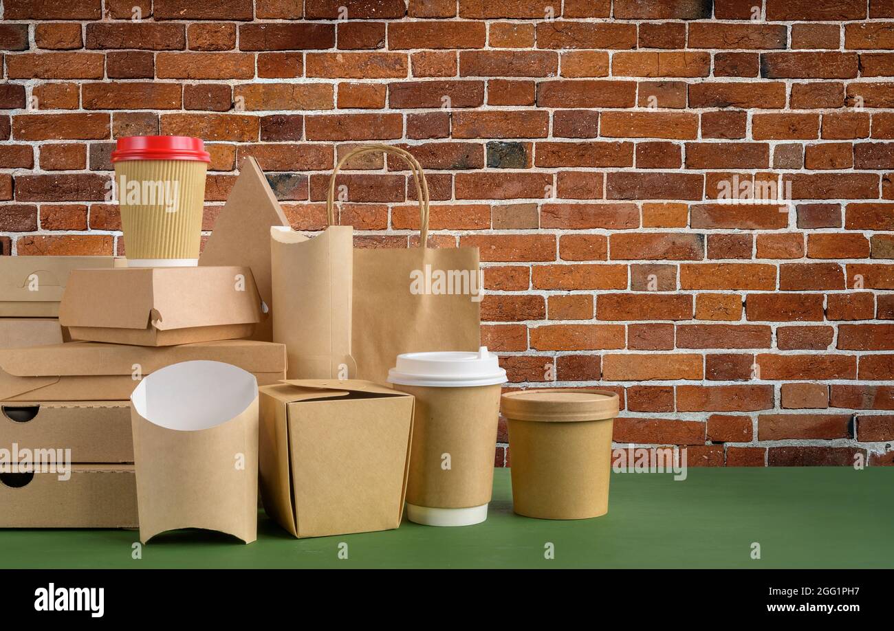 Fast food and drink package set on brick wall background. Food delivery ...