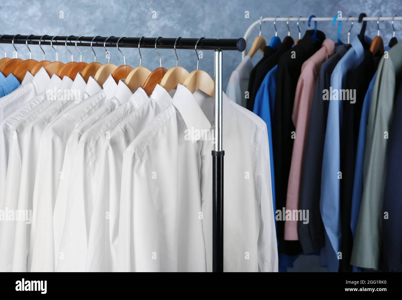 Rack of clean clothes hanging on hangers at dry-cleaning Stock Photo ...