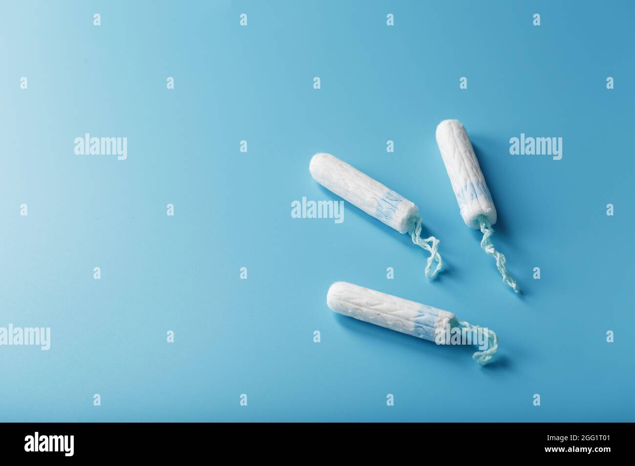 Gynecological tampons on a blue background, free space Stock Photo - Alamy