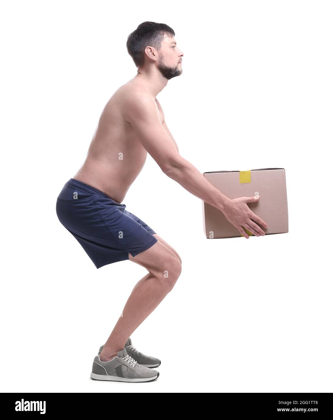 Man lifting heavy box back Cut Out Stock Images & Pictures - Alamy