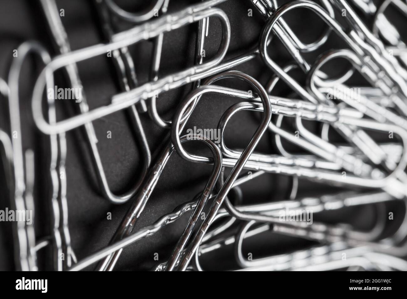 Paper clips scattered as textured background in full screen Stock Photo ...