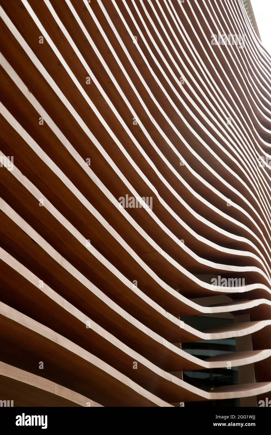 The outer wall of a commercial building representative waves of the sea ...