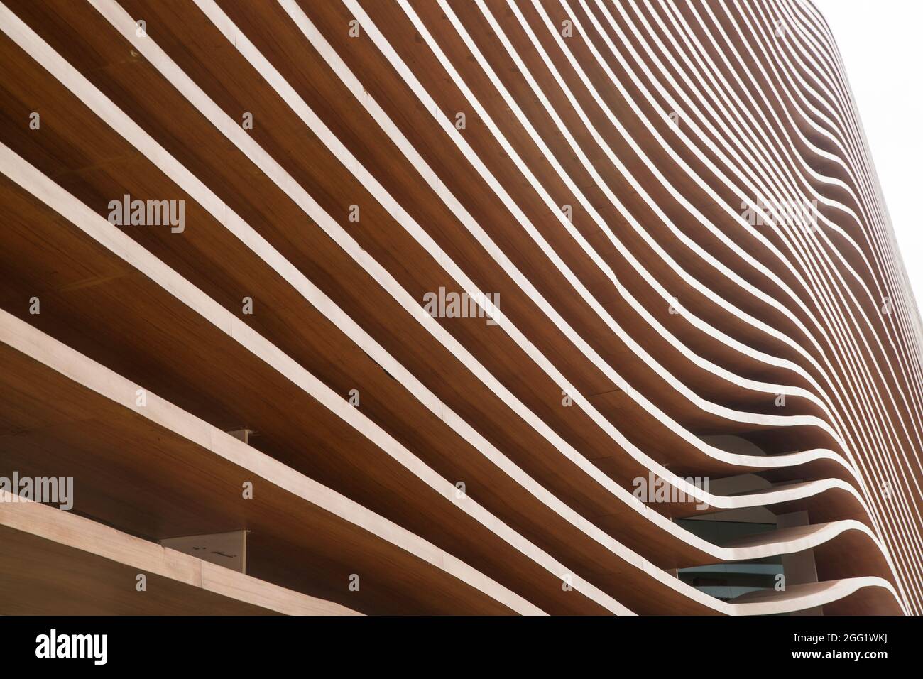 The outer wall of a commercial building representative waves of the sea ...