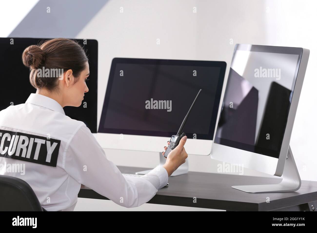 Female security guard on workplace Stock Photo - Alamy
