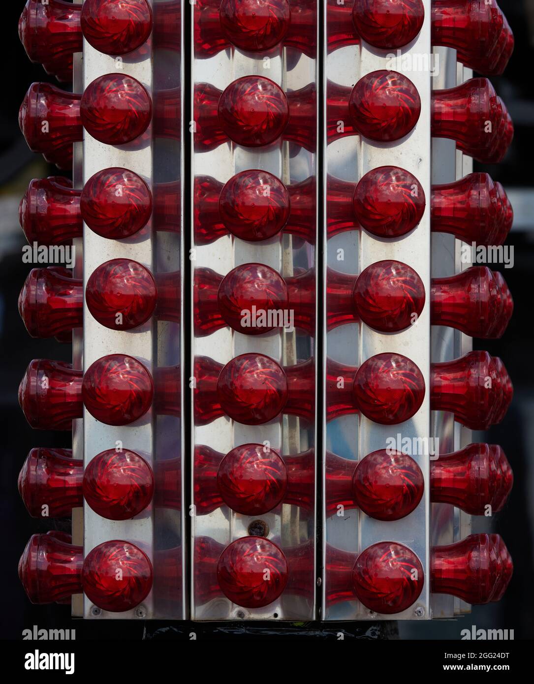 Row of red lamps forming a pattern and shape Stock Photo - Alamy