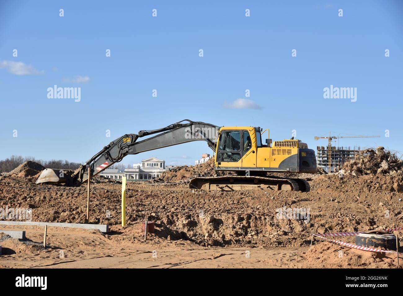Excavator during earthmoving work at construction site Stock Photo - Alamy