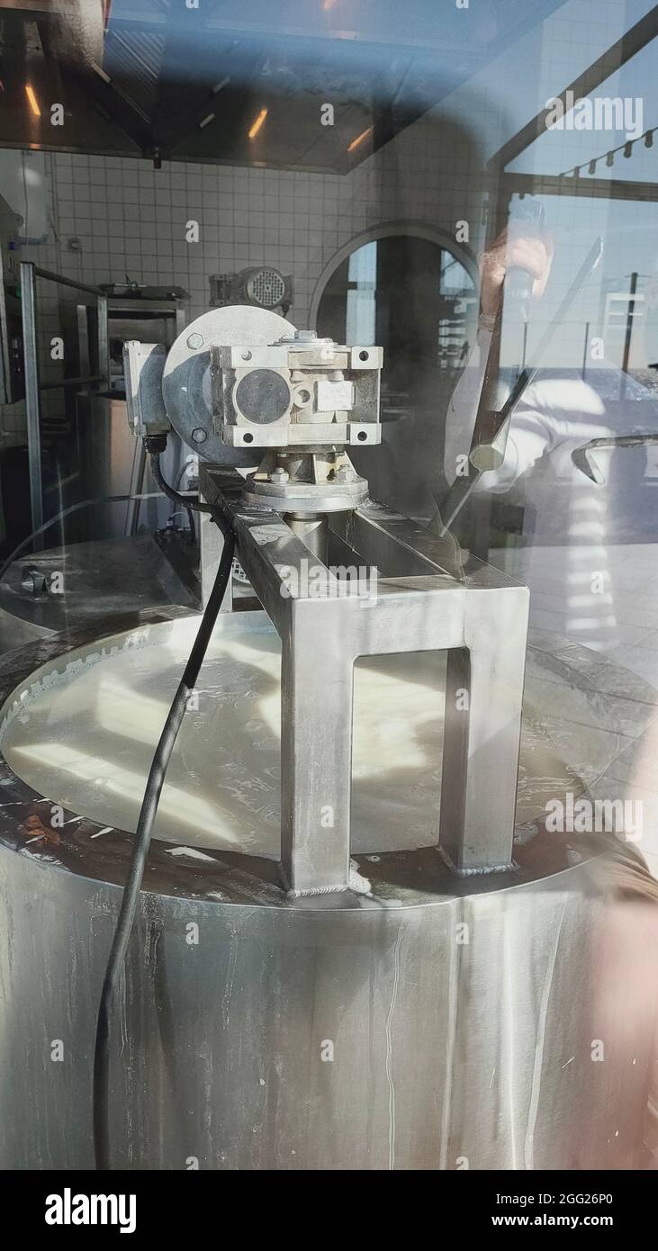Milk mixing in stainless tank during the fermentation process at the ...