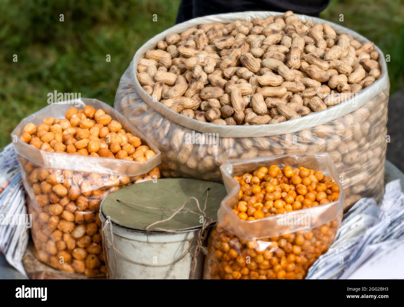 Peanuts, fried pea, and snacks on a bowl close up Stock Photo - Alamy