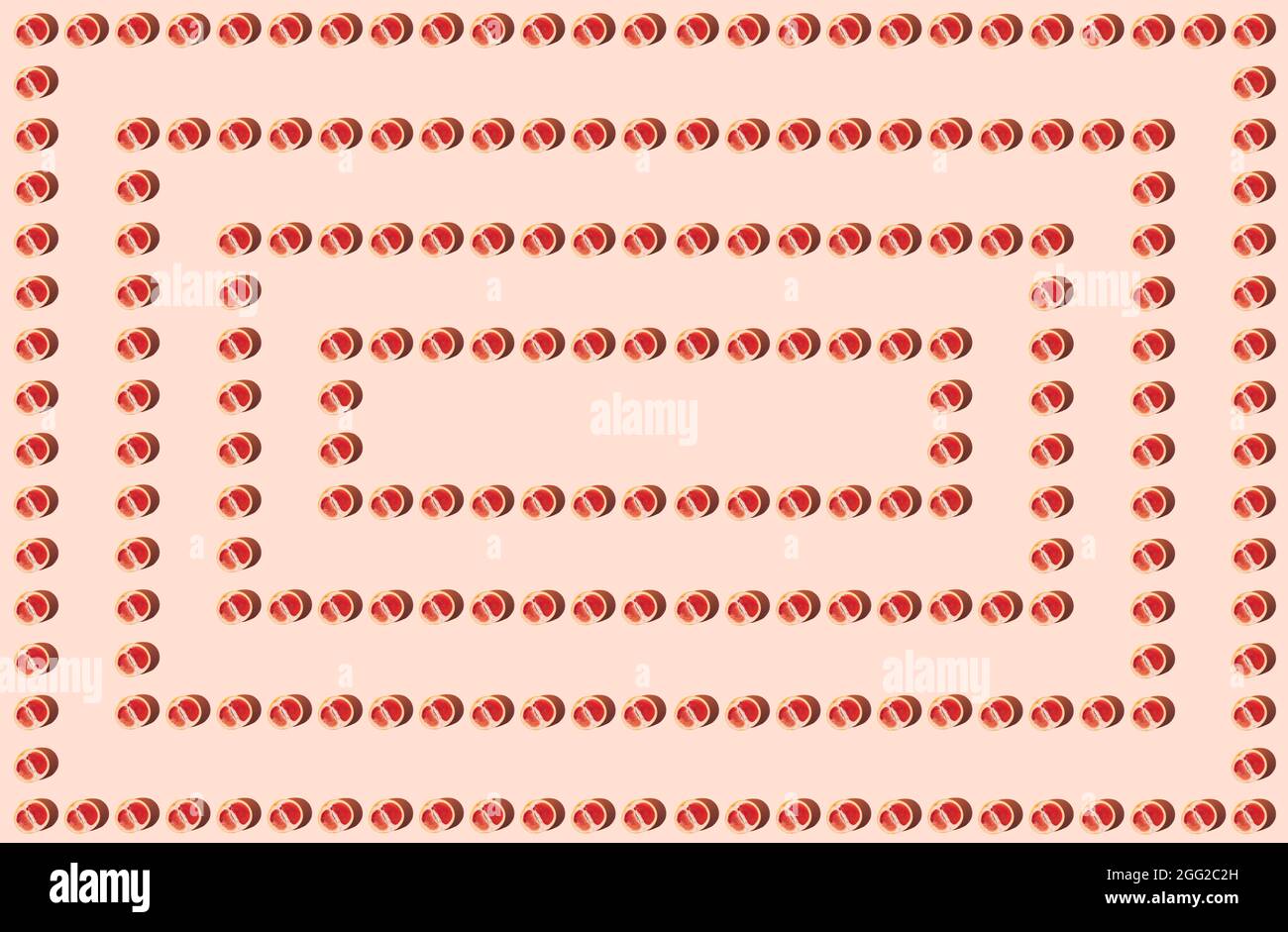 Rectangle pattern of fruit made of grapefruit on peach color background ...