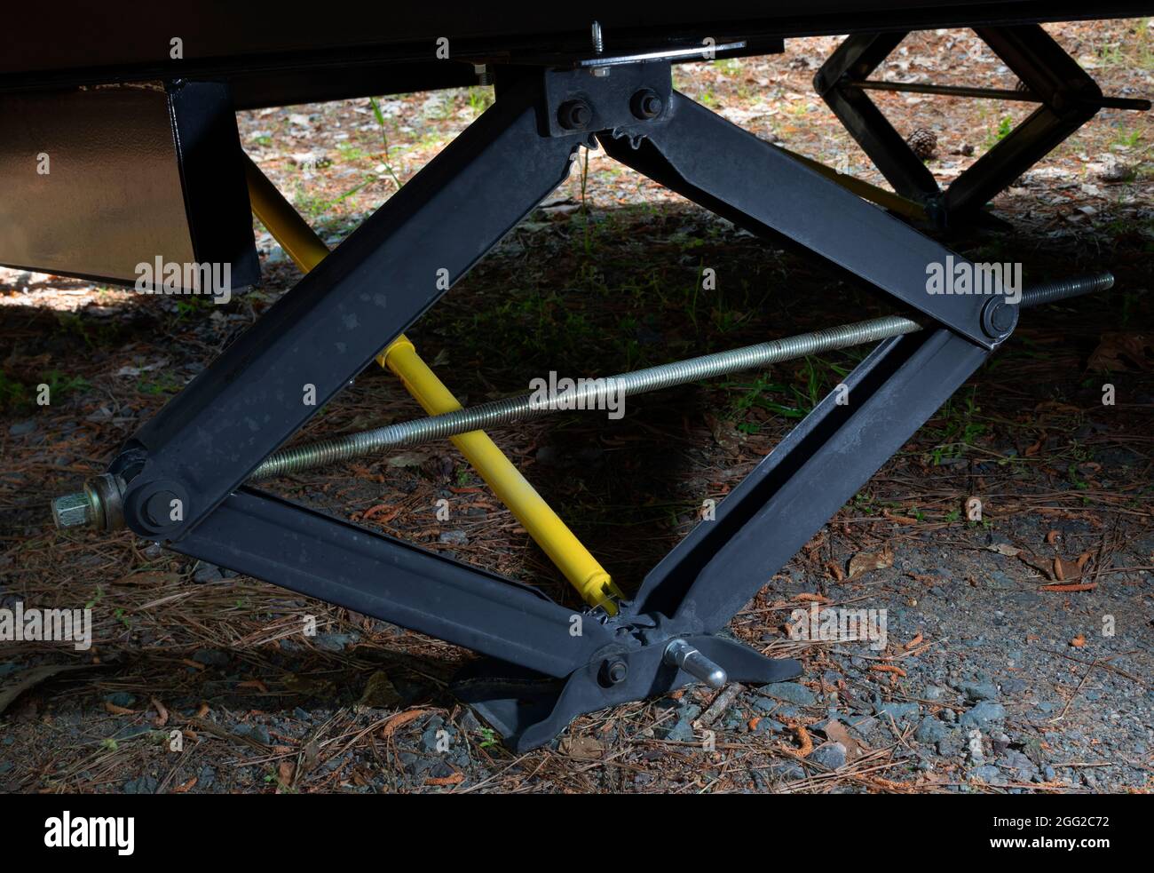 scissor jack deployed on the outrigger of a campter trailer Stock Photo ...